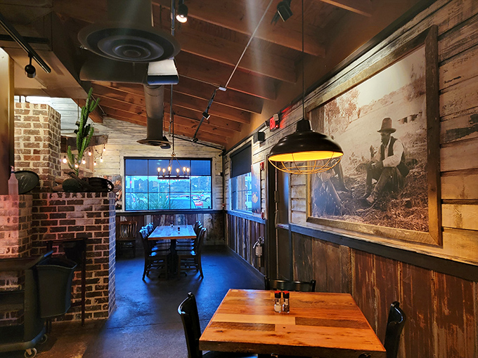 The dining area's rustic charm and vintage cowboy photography create an atmosphere where John Wayne would feel right at home ordering the porterhouse.