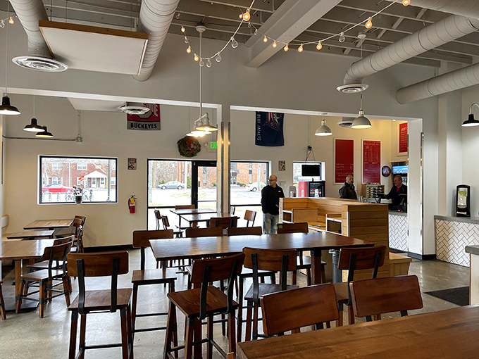 Clean lines, wooden tables, and string lights create an atmosphere where both first dates and family dinners can thrive without awkwardness.