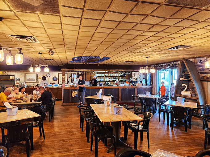 Simple wooden tables, practical chairs, and the promise of seafood worth sitting on anything for. No pretense, just good eating.