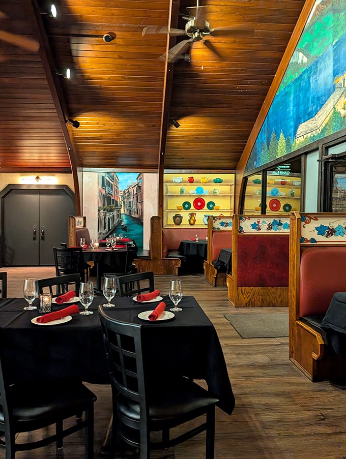 Tables set with military precision but the warmth of a Sunday family dinner – black tablecloths and red napkins creating the perfect stage for culinary drama.