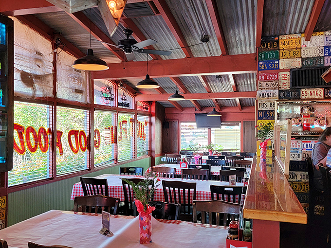 License plates from across America line the walls while checkered tablecloths invite you to settle in. This isn't dining; it's a slice of Americana served family-style.