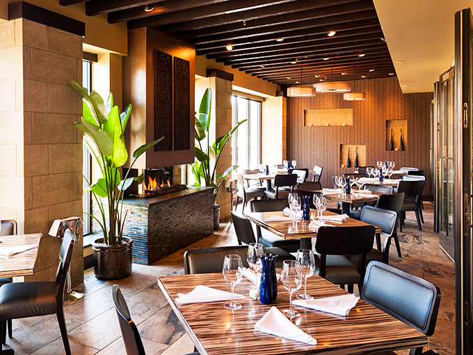 Dining room or modern oasis? Lush plants stand sentinel between elegant tables, while wood beams above remind you you're still in Pennsylvania, just fancier.