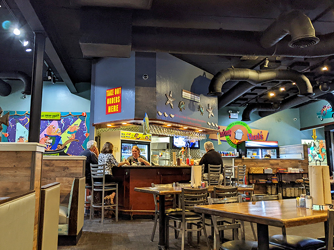 Exposed ductwork, colorful art, and a bar that beckons &ndash; this dining area feels like Florida's version of Cheers.