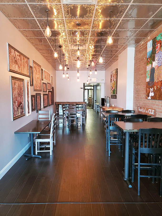 The dining area combines industrial chic with cozy warmth. Those pressed tin ceilings have witnessed countless moments of pure donut bliss.