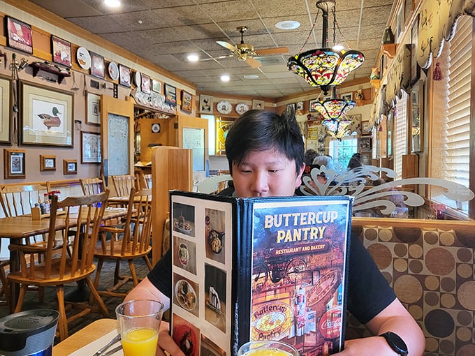 Where menus become windows to culinary possibility. The warm wood interior creates the perfect setting for breakfast decisions of monumental importance.