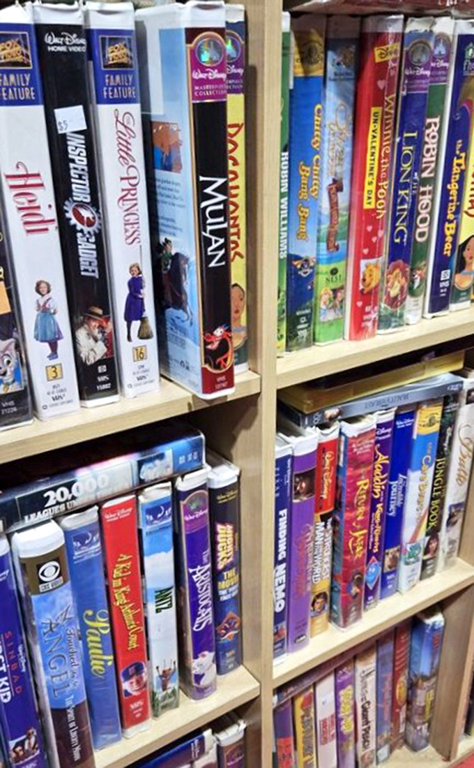 A time capsule of entertainment history lines these shelves &ndash; Disney classics in their original VHS glory await nostalgic movie nights.