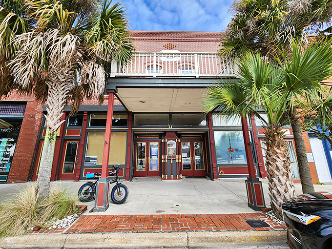 The Dixie Theatre's fa&ccedil;ade hints at entertainment treasures within&mdash;a cultural oasis where palm trees stand guard at the entrance.