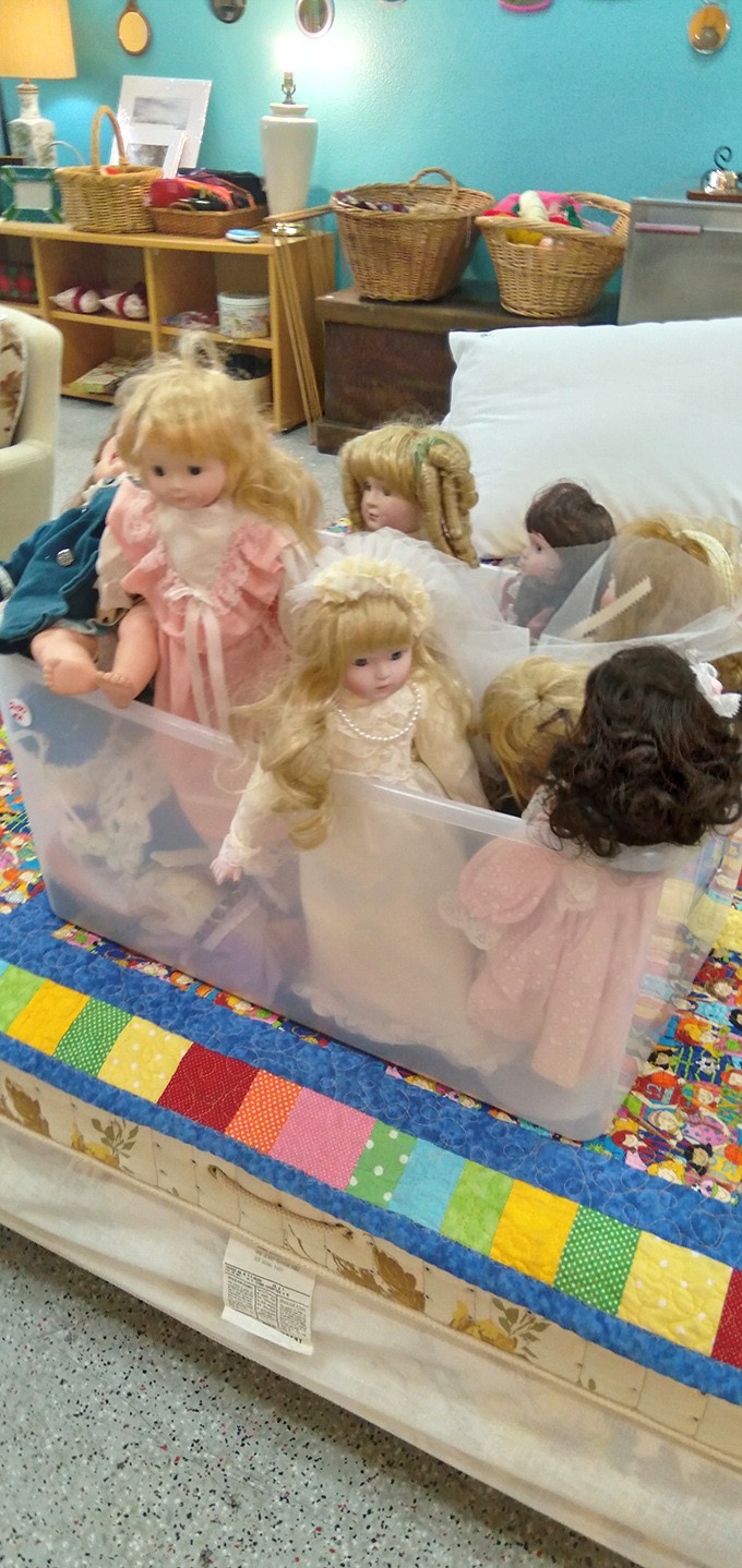 A box of porcelain memories—each doll waiting for someone who remembers when these were the must-have holiday gifts.