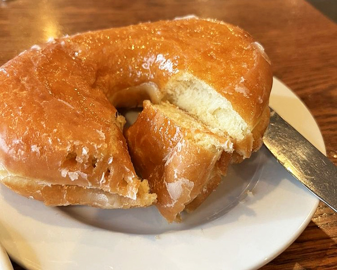 This isn't just a donut—it's a golden-brown halo of happiness that crackles with each bite. Worth every minute on the treadmill tomorrow.