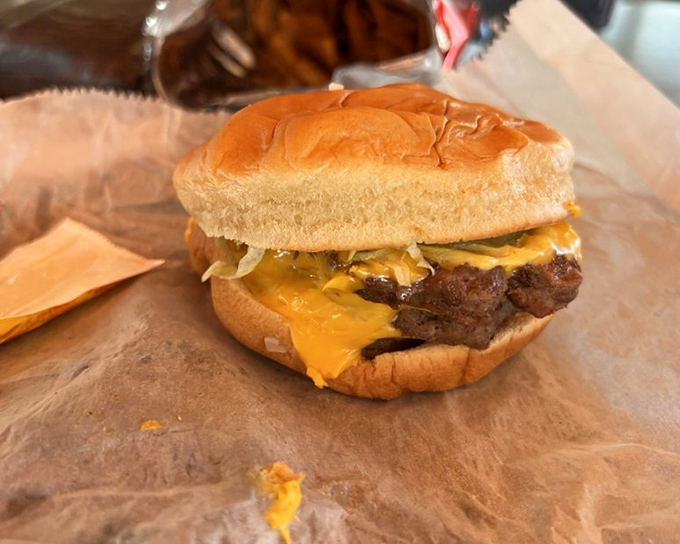 Behold the cheeseburger in its natural habitat&mdash;unpretentious, perfectly melted cheese cascading over a hand-formed patty on a pillowy bun.