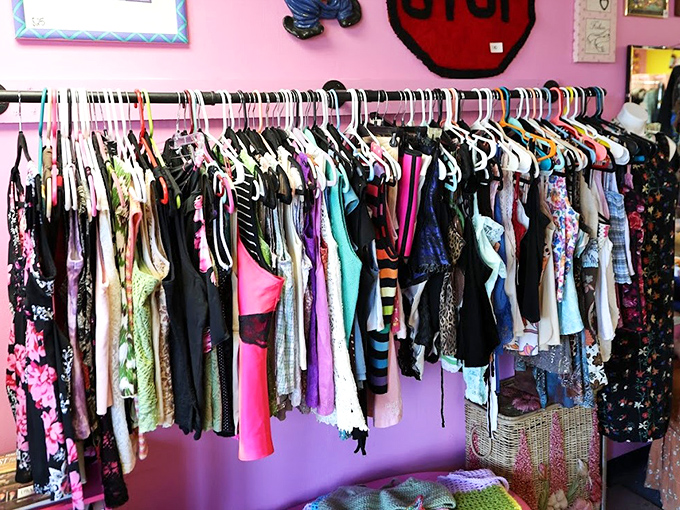 The purple wall section: where dresses from five different decades somehow make perfect sense together, like a time-traveling fashion show.