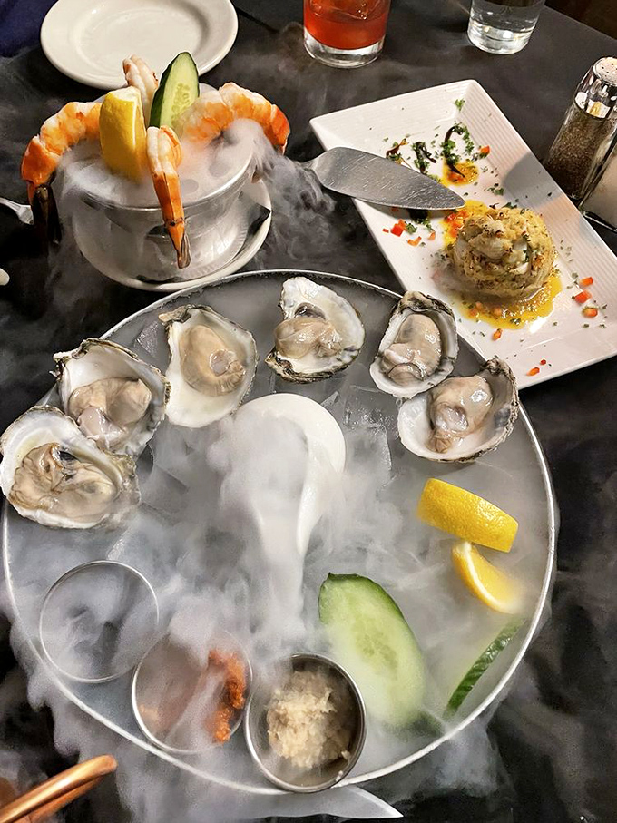 Oysters and shrimp cocktail presented on a bed of dramatic fog&mdash;seafood that knows how to make an entrance worthy of Broadway.