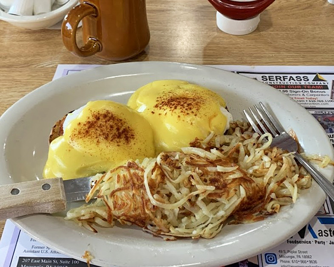Eggs Benedict that's dressed for success. Those hash browns aren't just a side dish—they're the supporting actor who steals the scene.