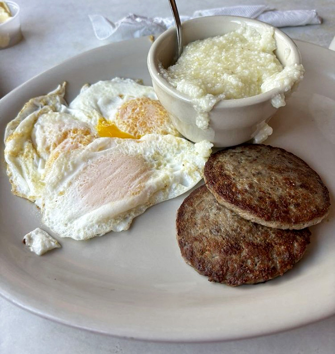 Two eggs sunny-side up with a side of sausage patties&mdash;proof that sometimes the simplest combinations create the most profound happiness.