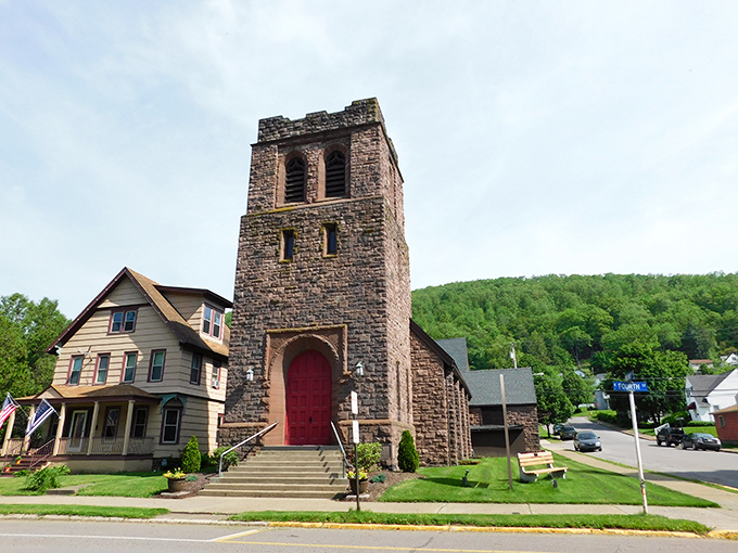 Stone towers and red doors welcome the faithful at Emmanuel Episcopal Church, where Sunday services come with a side of architectural splendor.