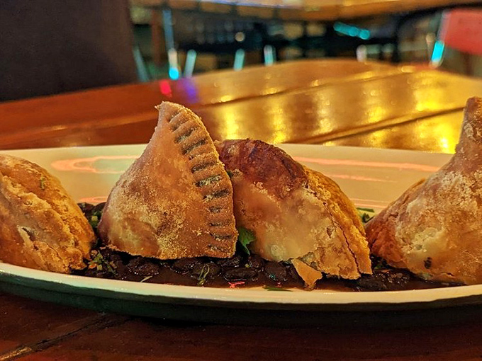 These empanadas look like they've been kissed by the gods of pastry&mdash;golden, flaky, and perched atop a bed of savory goodness.