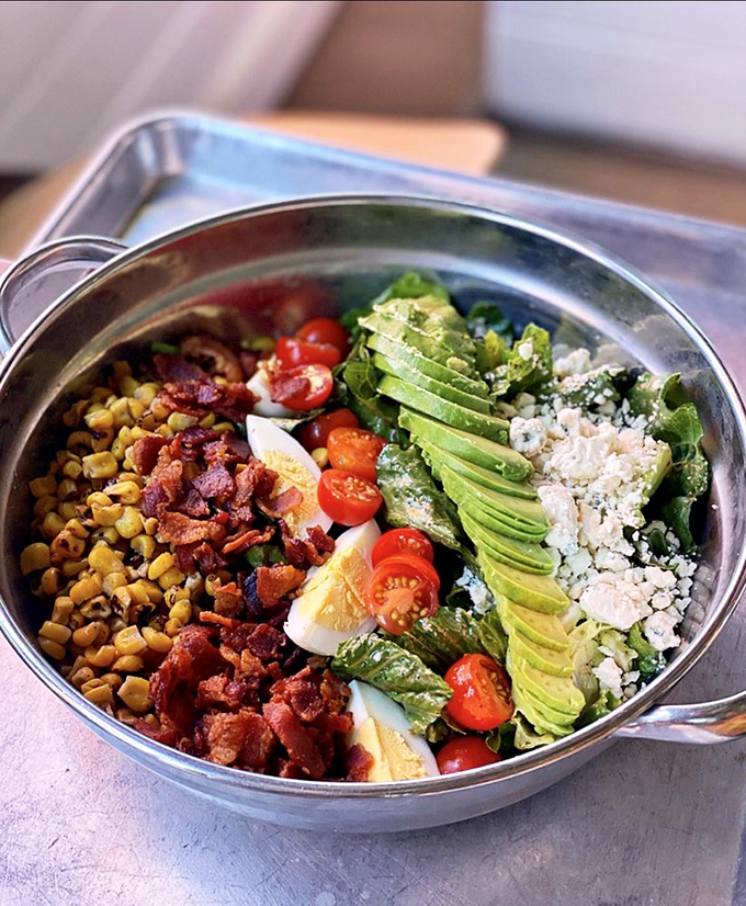 A salad that makes you forget you ordered "just a salad." This colorful arrangement has more layers than your favorite binge-worthy drama.