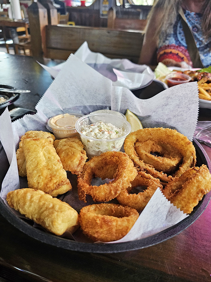 Golden-fried seafood and onion rings&mdash;proof that sometimes the simplest pleasures are the most profound. Dipping sauce not optional.