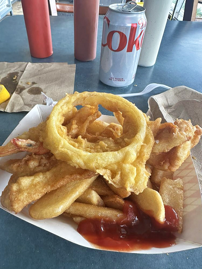 A paper boat filled with treasure more valuable than gold&mdash;perfectly fried fish and prawns that would make Neptune himself swim to shore.