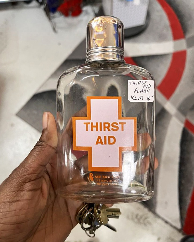 "Thirst Aid" indeed! This vintage flask isn't just a container – it's a conversation starter with a sense of humor drier than the spirits it once held.