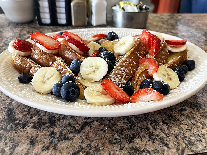 French toast that makes you question why you ever settled for regular toast. Those berries and bananas aren't garnish&mdash;they're supporting actors in breakfast theater.