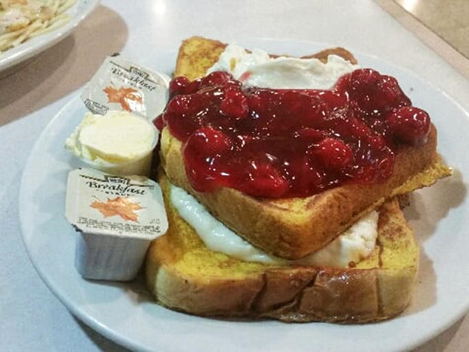 French toast topped with cherry compote&mdash;proof that sometimes the simplest pleasures are worth every sticky-fingered bite.