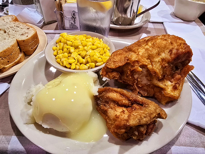 Fried chicken with that golden-ratio coating&mdash;crispy enough to hear it, tender enough to dream about it. Those sides aren't playing backup; they're co-stars.