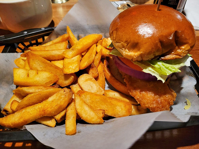 Sandwich architecture at its finest. This towering fried fish creation demands both hands and your complete attention&mdash;worth every delicious bite.