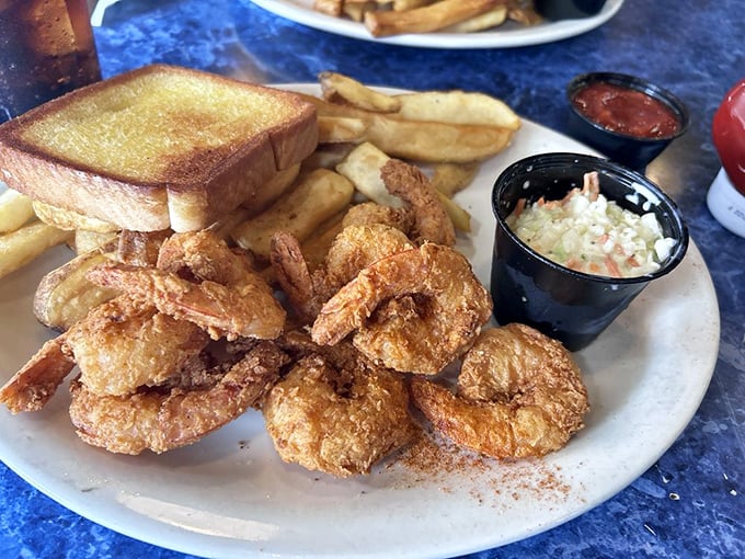 Golden-fried shrimp that crunch like autumn leaves, served with the kind of fries that disappear mysteriously fast.