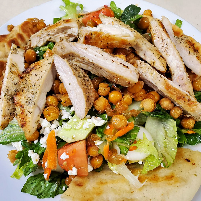 A salad that makes eating healthy feel like cheating. Grilled chicken and chickpeas transform ordinary greens into something extraordinary.