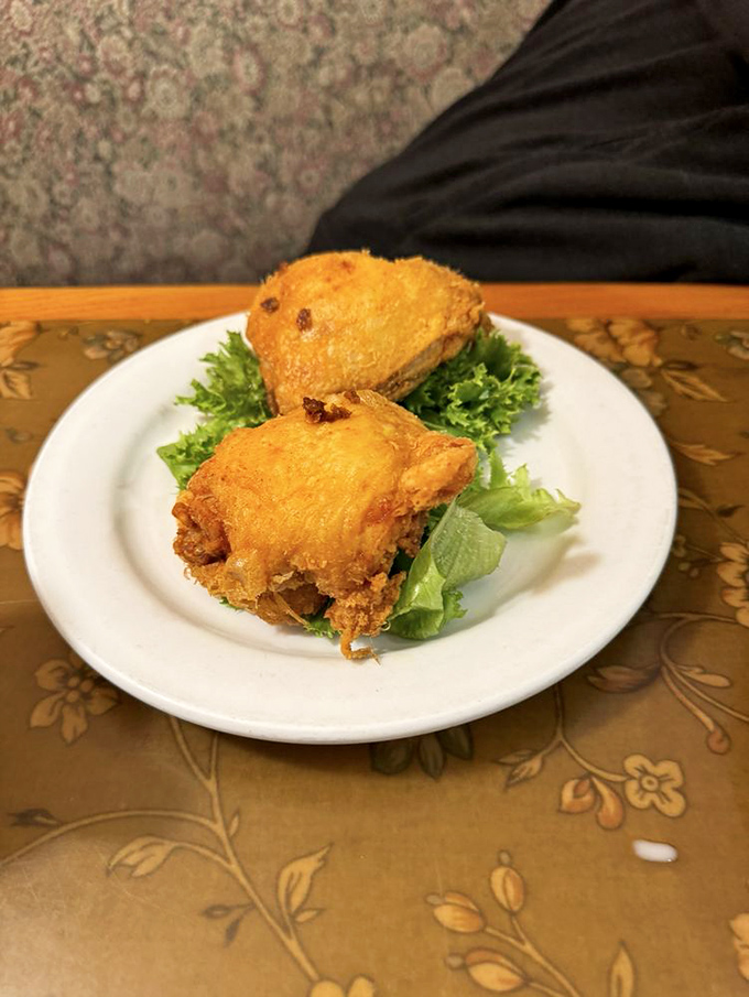 Golden-fried chicken perched on crisp lettuce &ndash; simple perfection that proves fancy plating is overrated when the cooking is this good.