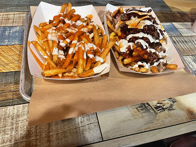 French fries elevated to art form&mdash;one basket naked, one loaded with enough toppings to qualify as its own zip code.