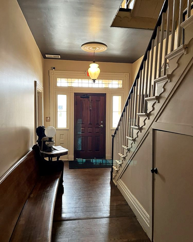The entryway feels like stepping into a time machine with better lighting. That staircase has witnessed more American history than most textbooks cover.