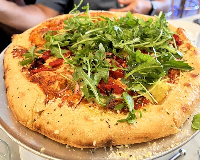 A pizza that ate its vegetables! Arugula and roasted tomatoes prove that sometimes what's good for you can also be what's delicious.