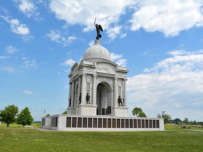 Monuments rise majestically from rolling fields, reminding visitors that this peaceful landscape once witnessed monumental history.