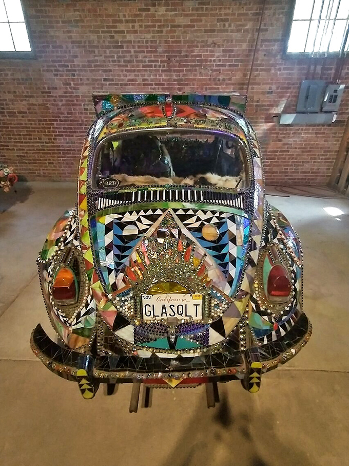 This mosaic masterpiece transforms transportation into a kaleidoscope of colors that would make any stained glass window envious. 