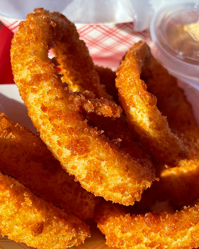 Golden rings of joy that shatter with each bite. These onion rings achieve that perfect balance between crispy exterior and sweet, tender onion inside.