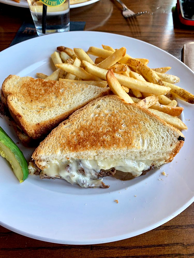 The humble grilled cheese, elevated to art form. That golden exterior promises the gooey, melty interior that your inner child still dreams about.