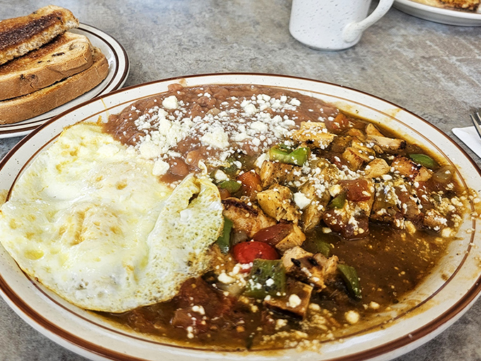 Mexican-inspired breakfast with eggs, beans, and salsa verde. The kind of plate that makes you rethink your morning routine entirely.