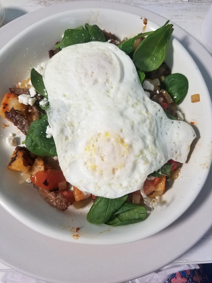 This skillet doesn't just break eggs—it breaks the monotony of ordinary breakfasts. Fresh spinach and feta add Mediterranean flair to morning comfort.