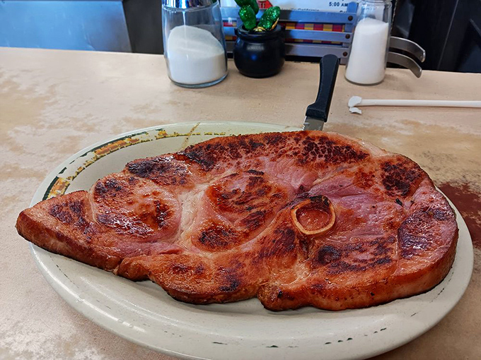 Ham steak so impressive it deserves its own ZIP code. This isn't some dainty breakfast meat&mdash;it's what lumberjacks dream about.