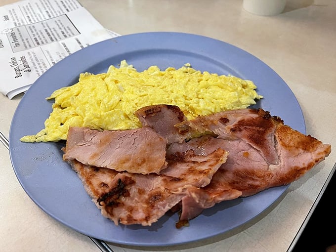 Ham slices thick enough to use as bookmarks, paired with eggs that know their job and do it well.
