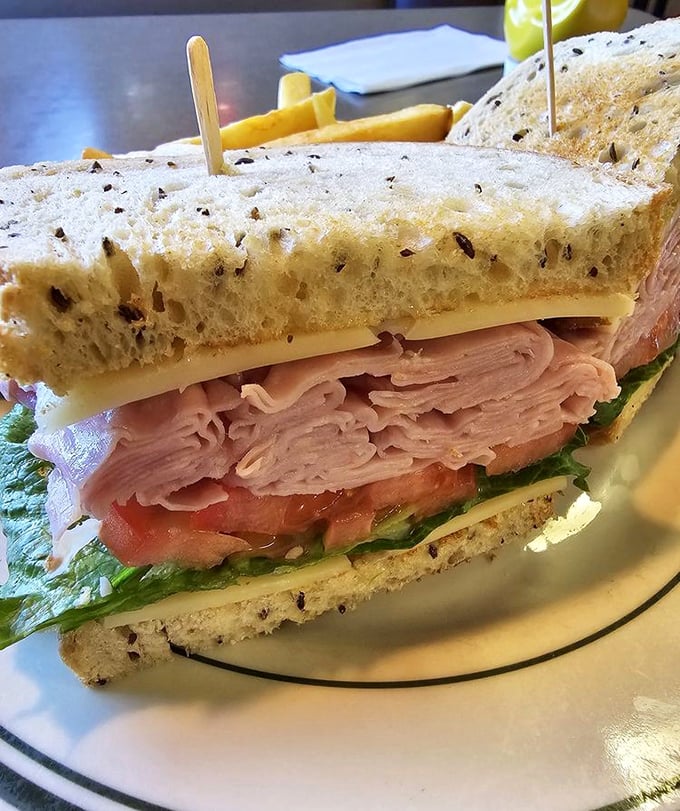 A sandwich built like a skyscraper of flavor, where each layer—from the hearty turkey to the garden-fresh veggies—plays its part perfectly.