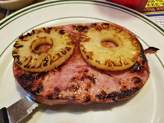 Grilled ham steak with caramelized pineapple rings &ndash; a retro flavor combination that proves some classics never need updating.