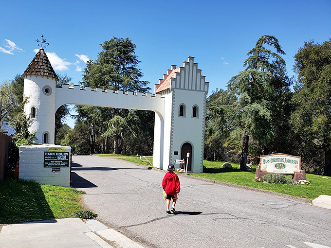 A child walks toward adventure at Hans Christian Andersen Park&mdash;proof that some experiences are magical at any age.