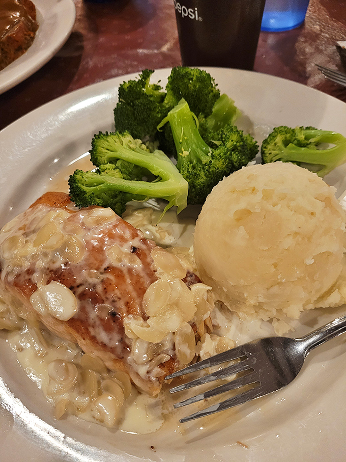 Salmon that's dressed better than most people at a wedding. Those mashed potatoes could apply for their own comfort food PhD.