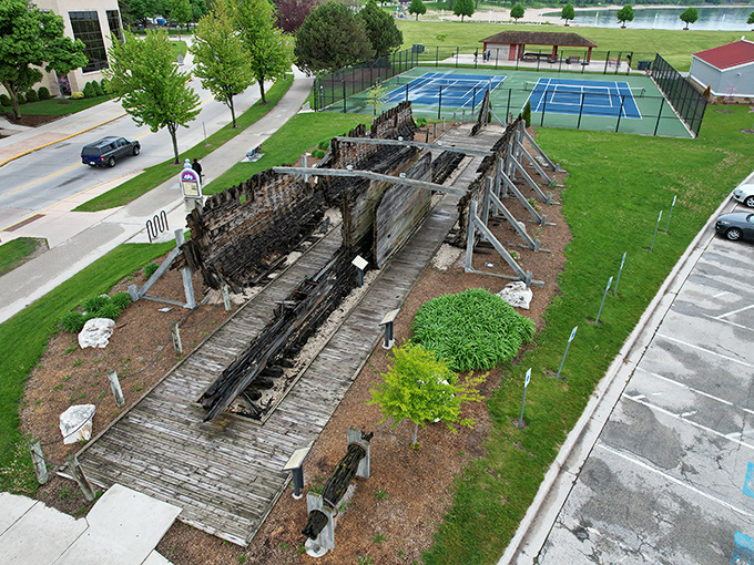 The Lottie Cooper shipwreck display stands as a wooden testament to Lake Michigan's might and maritime history's enduring fascination.