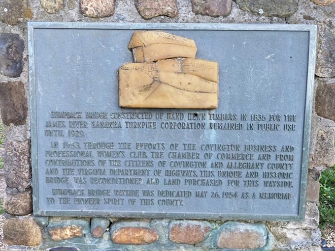 History cast in bronze tells the bridge's remarkable journey. This plaque reveals how community determination saved a landmark that nearly vanished to progress.