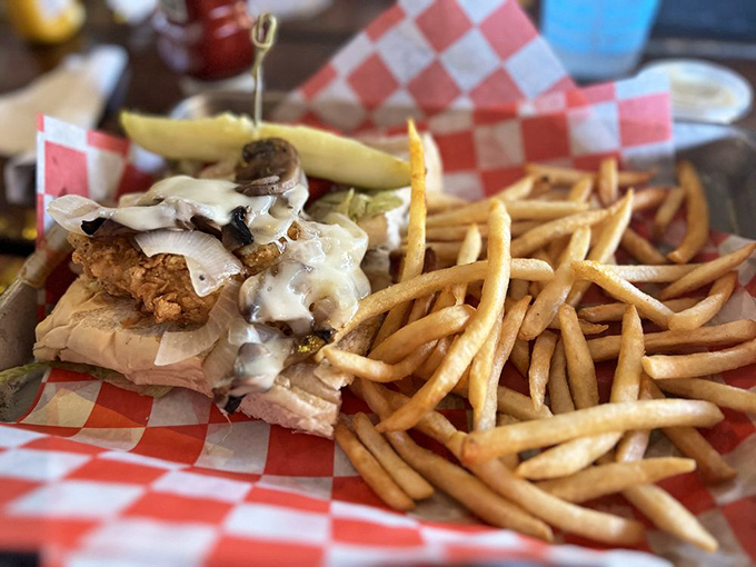 The famous Hogfish Sandwich arrives like a delicious architectural challenge—how to fit something this magnificent into your mouth without wearing it.