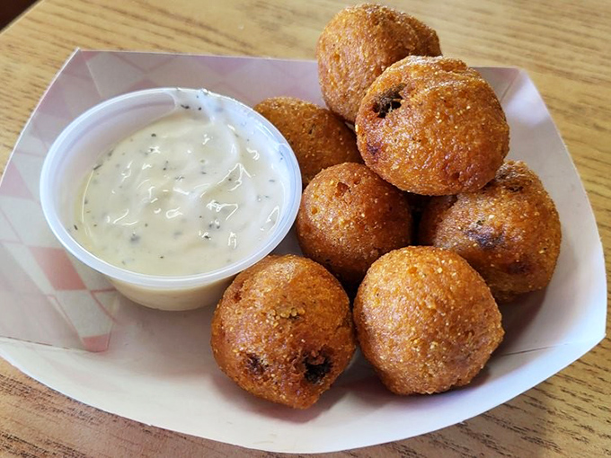 Hush puppies that speak volumes about flavor. These golden orbs of cornmeal joy are the unsung heroes of the fried food universe.